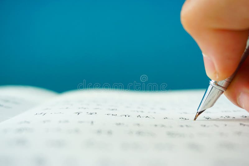 Writing Chinese Characters on Paper with a Fountain Pen Stock ...