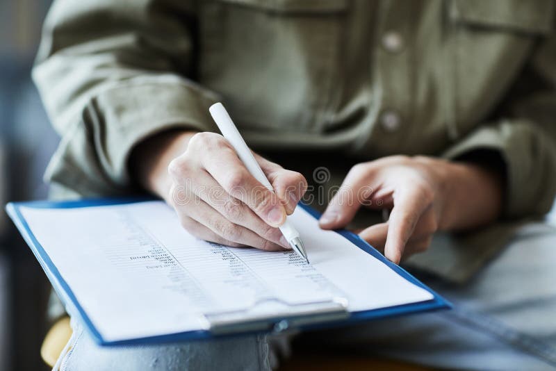 Writing on Clipboard Closeup Stock Image - Image of school, chairs ...