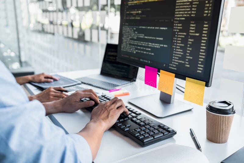 Writing Codes And Typing Data Code Technology Programmer Cooperating Working On Web Site