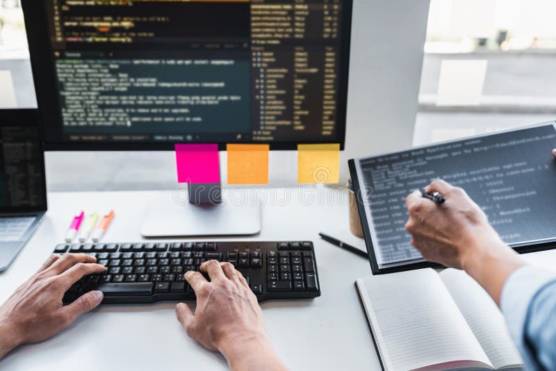 Writing Codes And Typing Data Code Technology Programmer Cooperating Working On Web Site