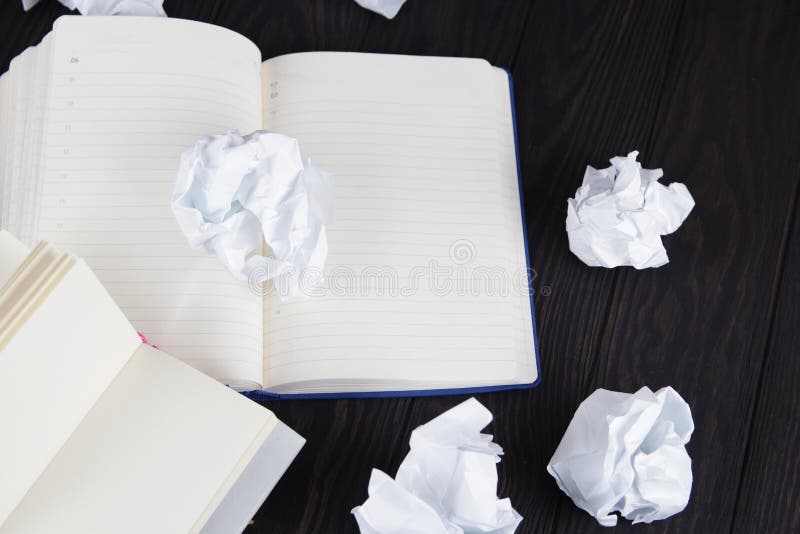 Writing Concept - Crumpled Up Paper Wads with a Sheet of White Paper ...
