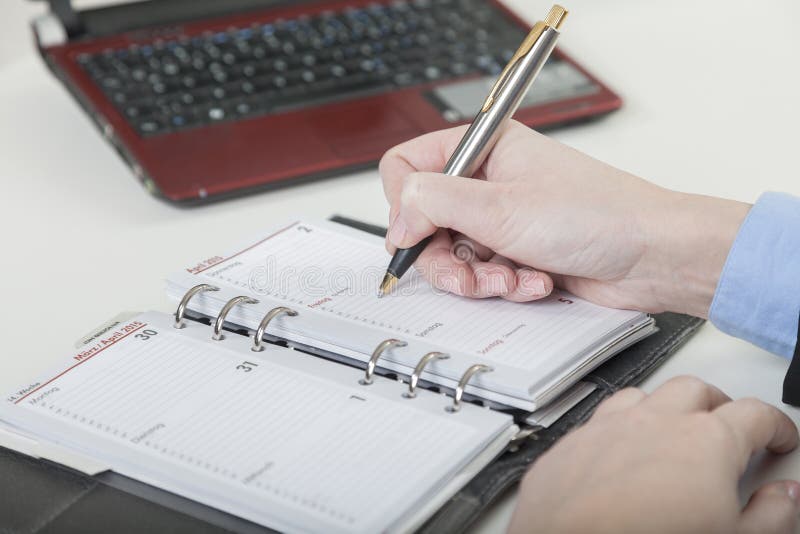 Writing Down an Appointment into Diary Stock Photo - Image of business ...