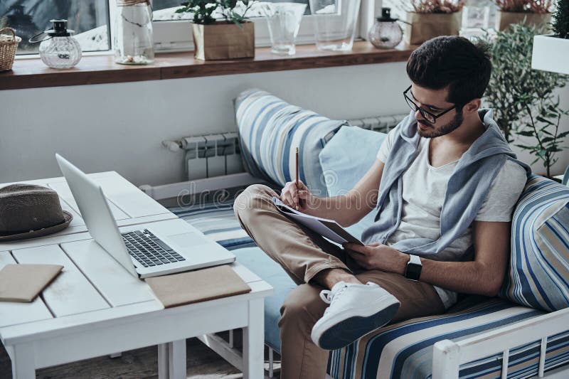 Writing down his thoughts. stock image. Image of looking - 89812891