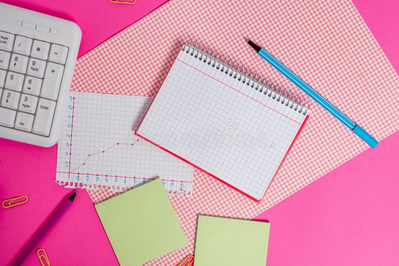 Writing Equipments and Computer Stuffs Plus Mathematic Paper Placed on ...