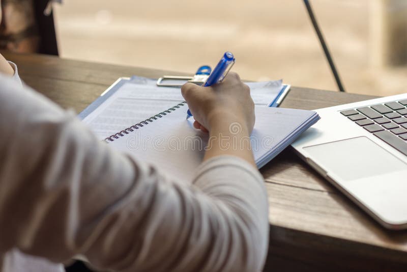 Writing Important Information from Email To Notebook Stock Photo ...