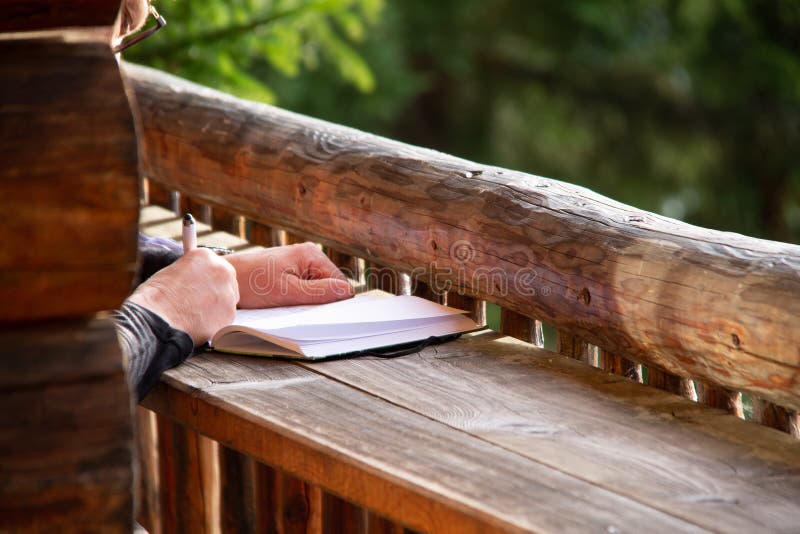 Writing in a Journal at a Cabin in the Forest Stock Image - Image of ...