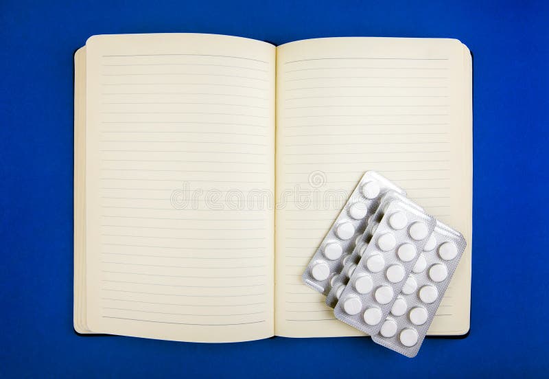 Notepad with a Pills stock photo. Image of indoor, note - 134519546