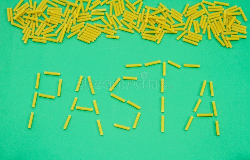 Writing Pasta on a Green Background with the Macaroni Type Pasta with ...