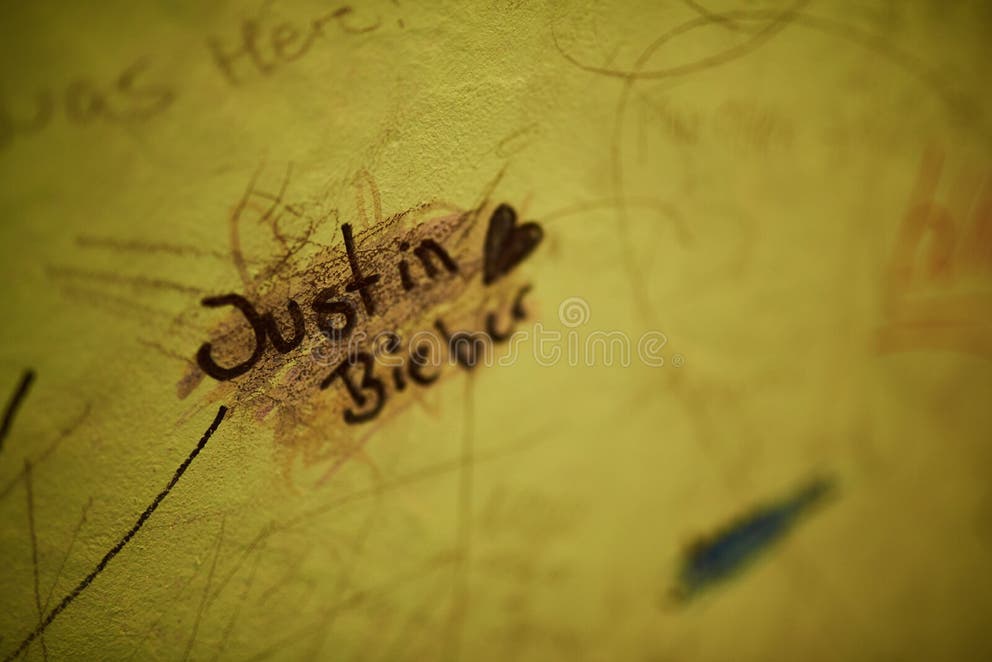 Writing of Pop-star Name on a Yellow Wall Stock Photo - Image of ...