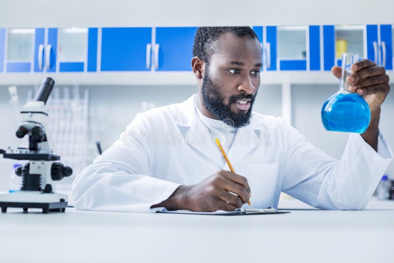 Serious Professional Chemist Taking Notes Stock Photo - Image of ...