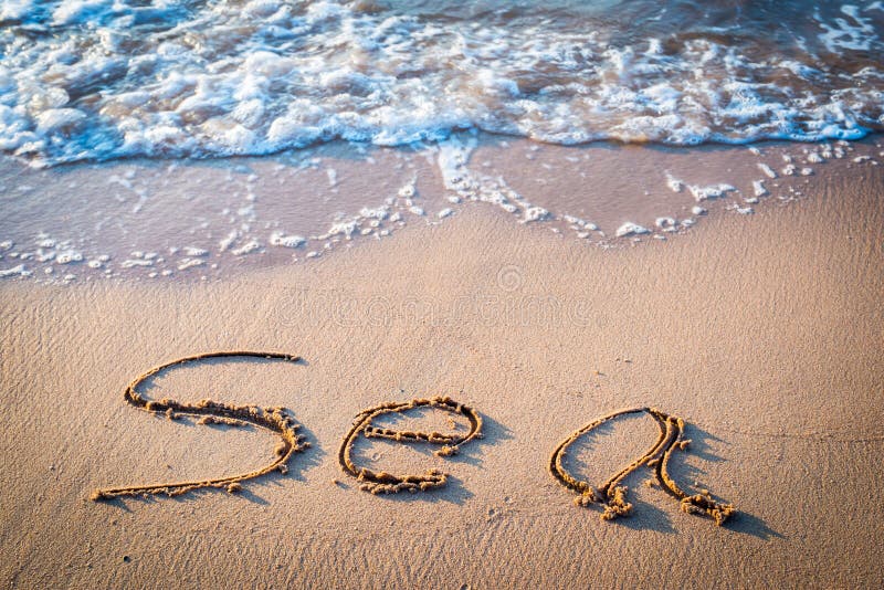 Writing Sea on the Beach stock image. Image of horizontal - 39088309