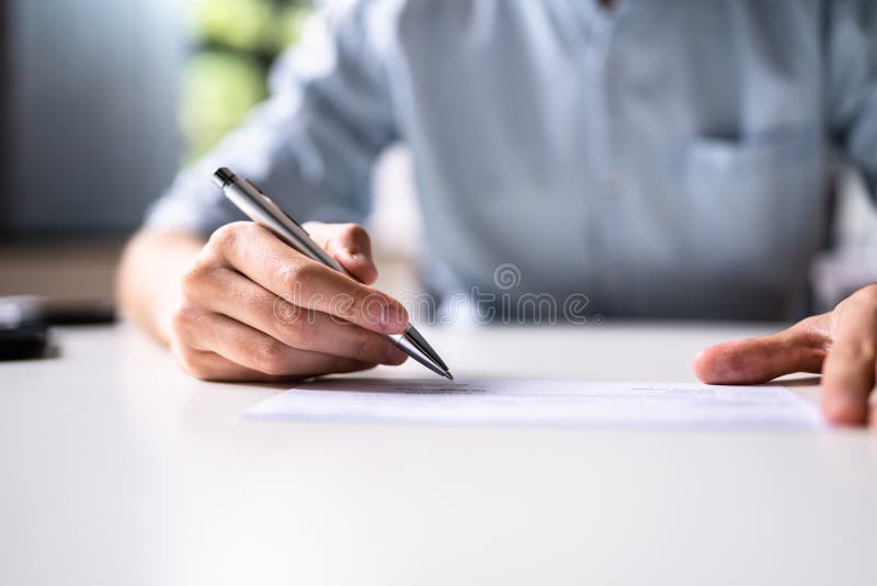 Signing the Check stock image. Image of business, payment - 985053