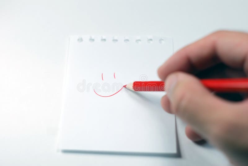 Writing a Smiley on a Note Paper Stock Photo - Image of gift, hold: 5964236