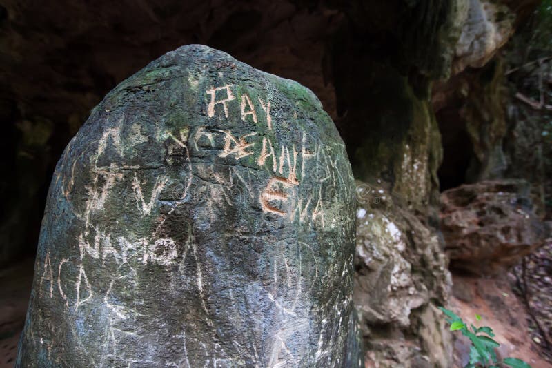 Writing on Stone in Cave by Unconscious Person. Stock Photo - Image of ...
