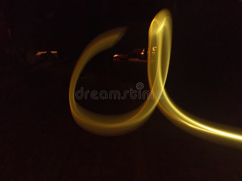 Writing a Using Light Painting Techniques, with Yellow Lights. Stock ...