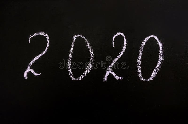 2020 Written in Chalk on a Black Chalkboard. Top View. Close-u Stock ...