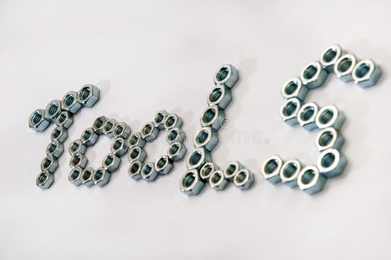 Written Word Tools with Many Metal Nuts Stock Photo - Image of isolated ...