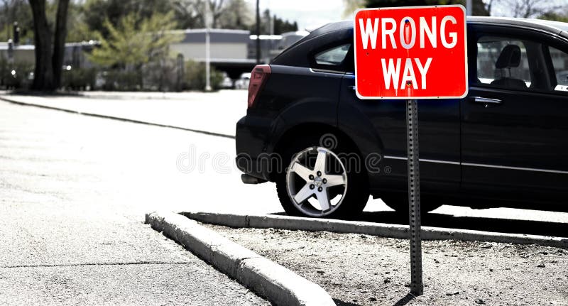 Wrong Way Parking Sign for Direction in Car Lot Stock Image - Image of ...