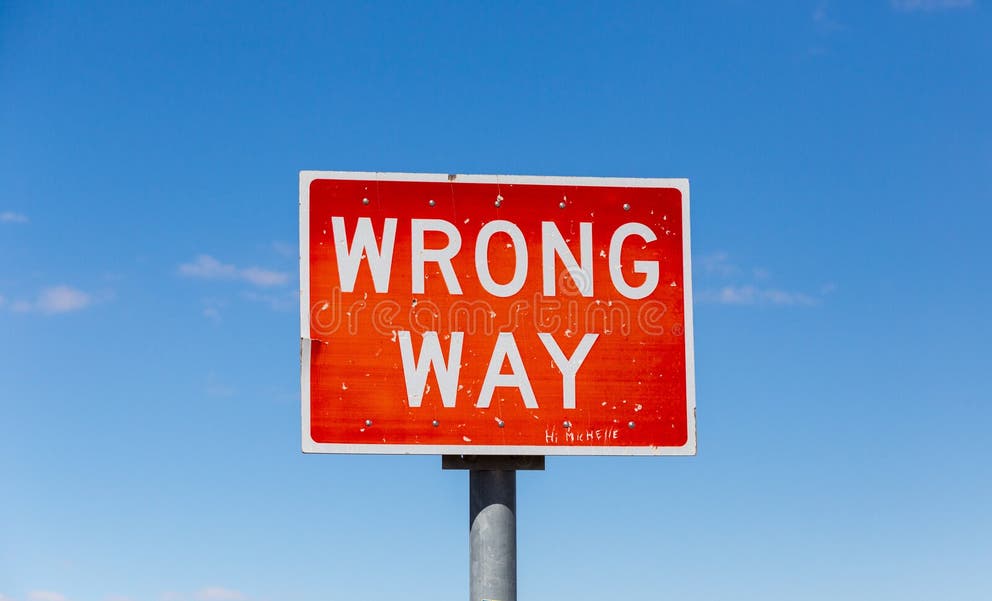 Wrong Way Road Sign Isolated Against Sky Stock Image - Image of ...