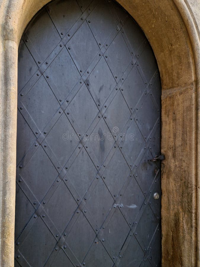Wrought Iron Door with Grid Pattern. Medieval Style with Rivets Stock ...