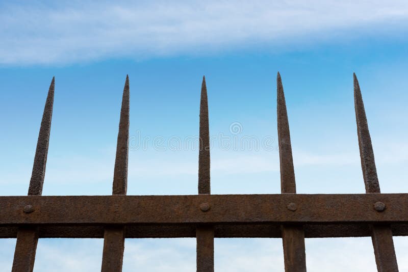 Wrought Iron Fence with Sharp Points on Blue Sky with Clouds Stock ...