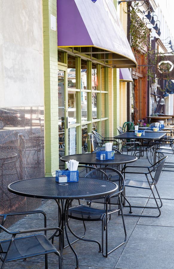 Wrought Iron Tables on Small Town Sidewalk Stock Image - Image of ...