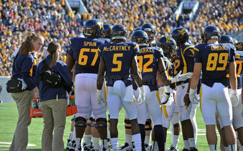 WVU Football - Offense Huddle Editorial Photography - Image of meet ...