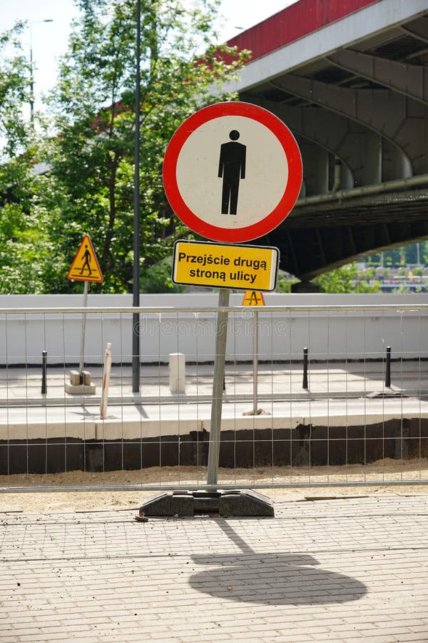 "Crossing on the Other Side of the Street" Sign, Vertical Stock Photo ...