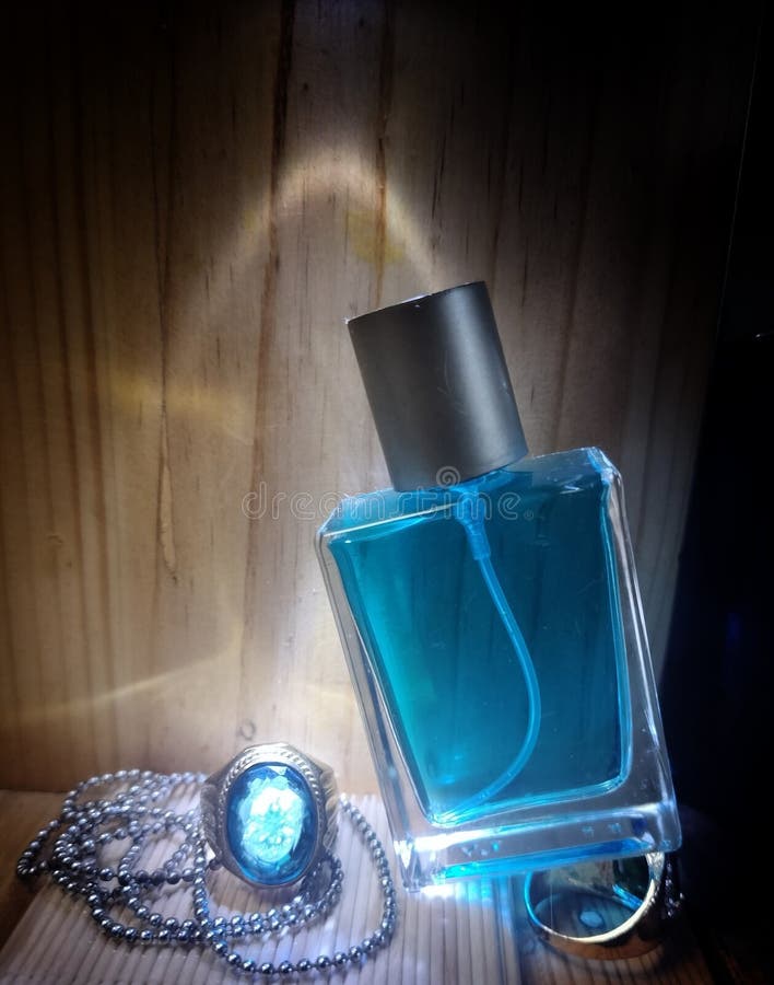 Blue Perfume Bottle with a Heart Shape Tag. Stock Image - Image of ...
