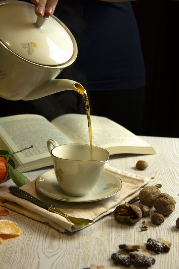It s time to pour the tea. stock image. Image of humanbodypart - 206266175