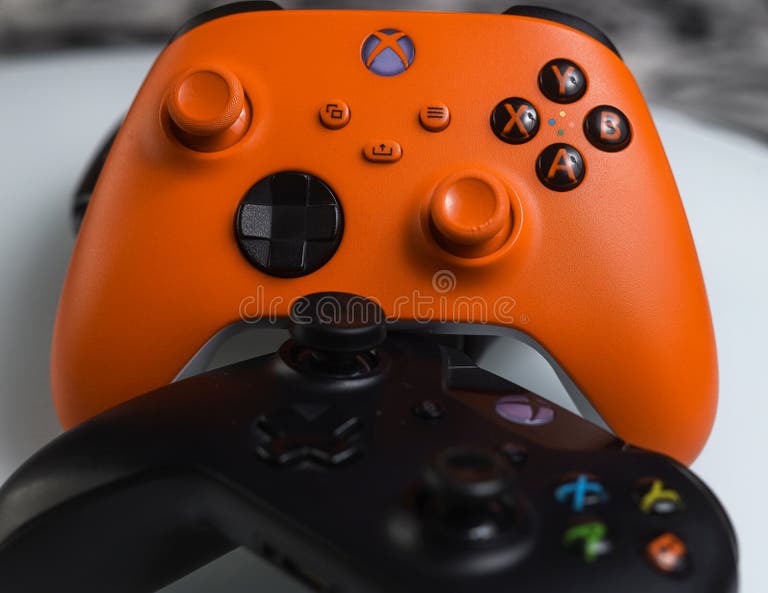 Xbox Game Controllers. Orange Game Controller Editorial Stock Image ...