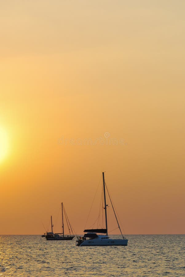 Yacht at the Beach during Sunset Stock Photo - Image of horizon ...