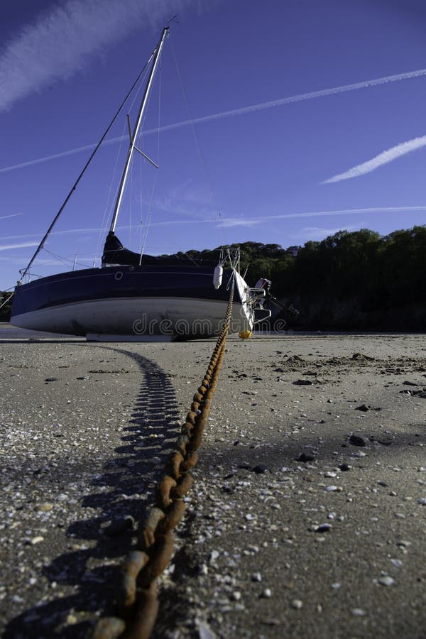 Yacht Boat on a Sandy Beach Tethered with a Rusty Chain Stock Image ...