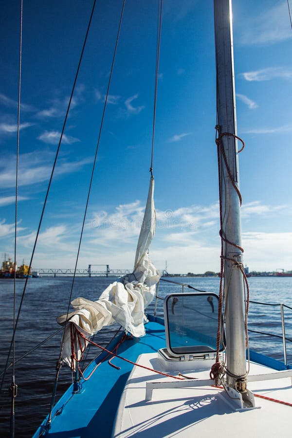 Yacht Mast with Folded Sail and Blue Water Stock Image - Image of blue ...