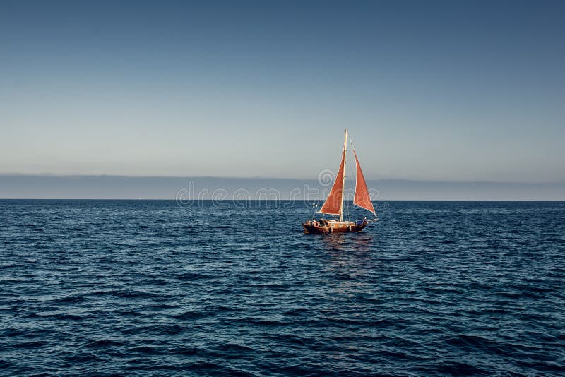 Yacht with a Red Sail in the Sea Stock Photo - Image of nautical, mood ...