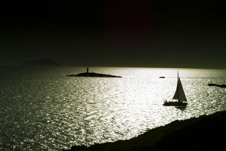 Yacht Sailing between Islands in the Sunset Stock Photo - Image of ...