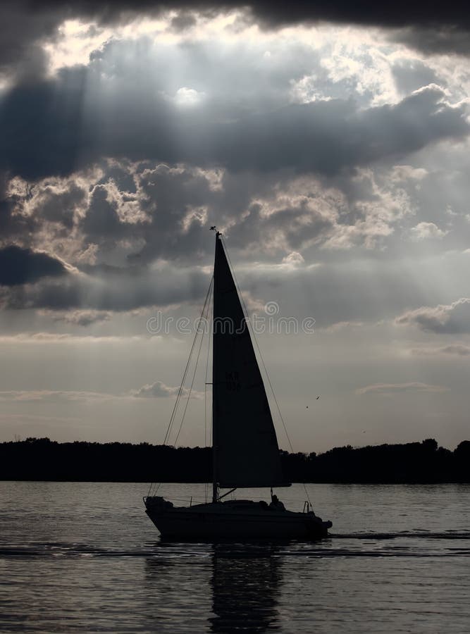 Yacht Under the Celestial Rays Stock Image - Image of sunny, power ...