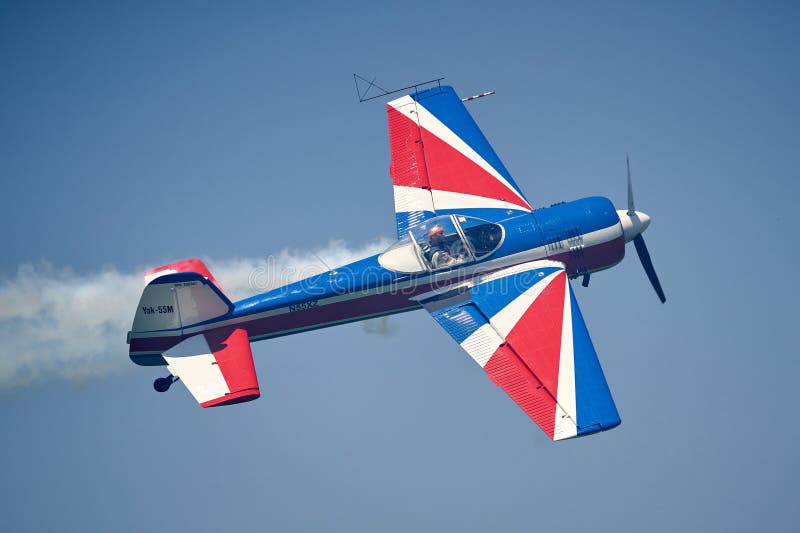 A Yak-55M Single-engine Propeller Aircraft in Flight Against a Clear ...