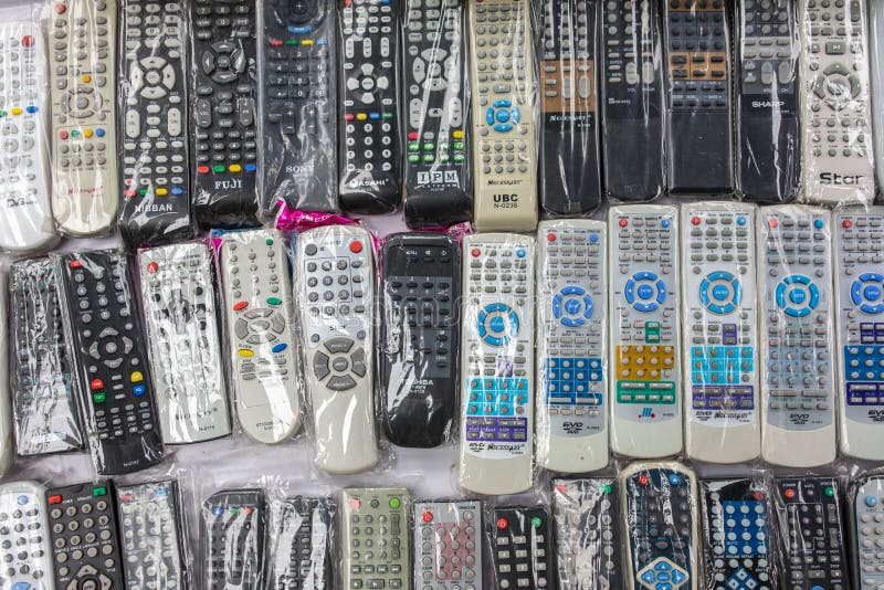 Many TV Remotes on a Gray Concrete Table. Top View. Remote Control of ...