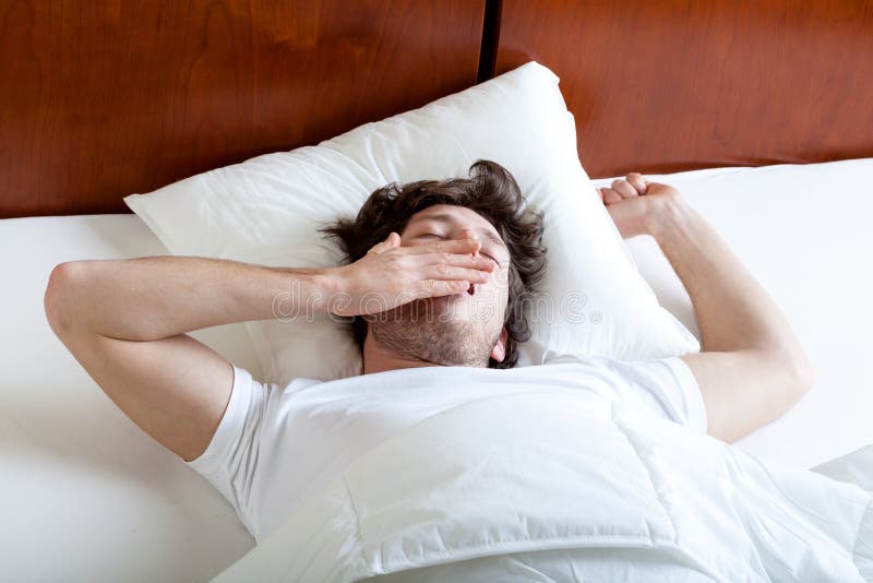 Man Startled Awake by Intruder Stock Photo - Image of businessperson ...