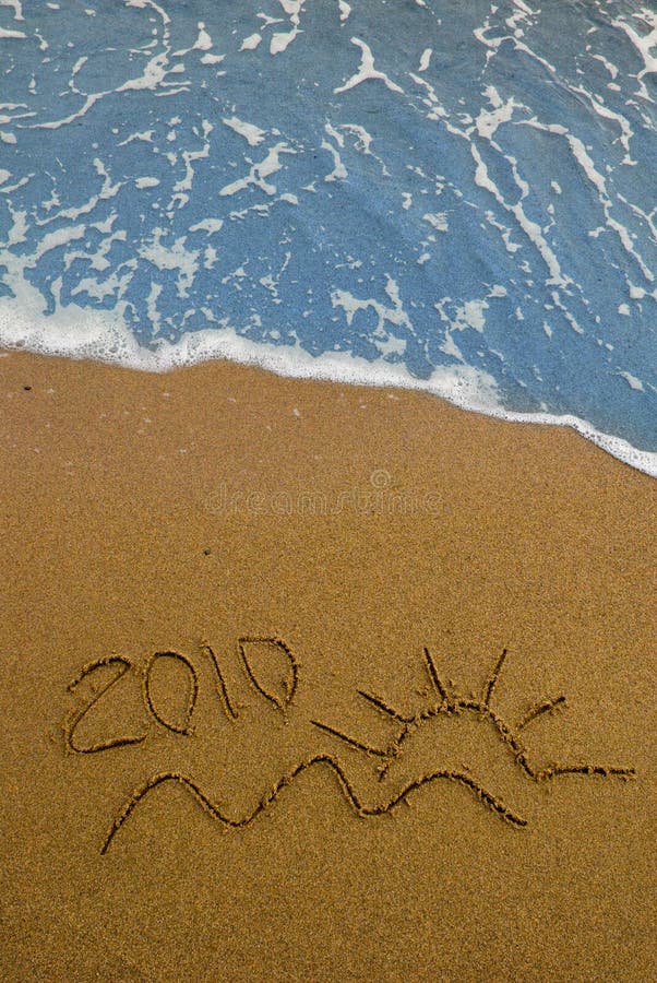 Year 2010 written on sand stock image. Image of horizontal - 11398833