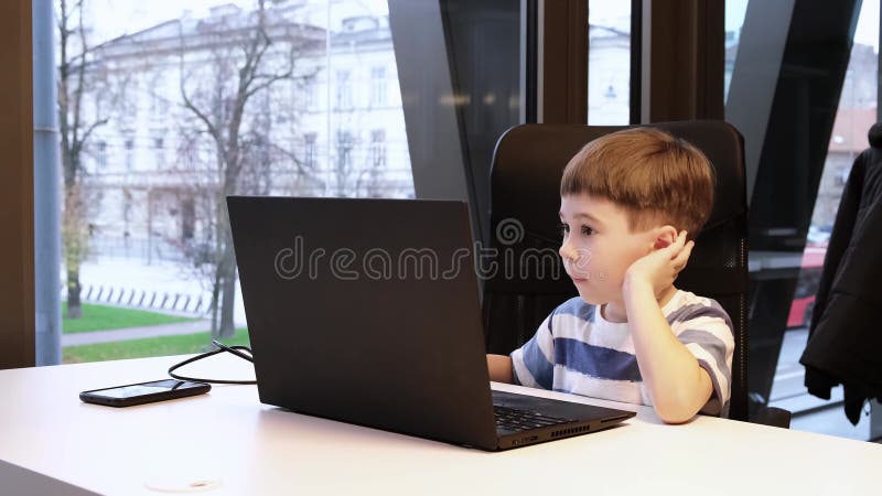 6 Year Boy Using Laptop in Office. Distance Self Education. Programming ...