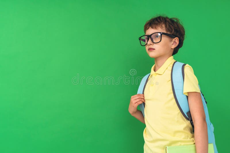 7-year-old Boy with Backpack on His Back, Looking into Distance Stock ...
