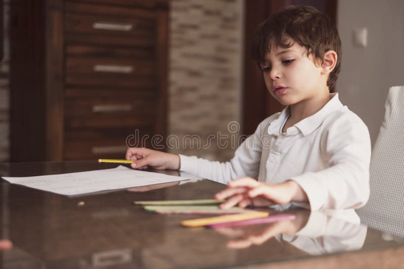 4-year-old Boy Does Homework at Home.he Does Addition and Subtraction ...