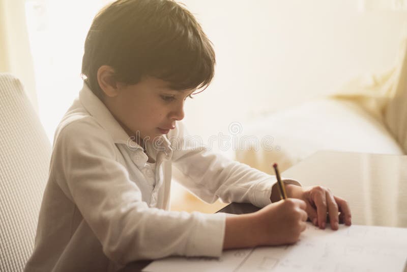 4-year-old Boy Does Homework at Home.he Does Addition and Subtraction ...