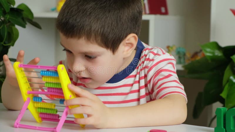 A 5-year-old Boy is Learning To Count on Abacus, Mathematics ...