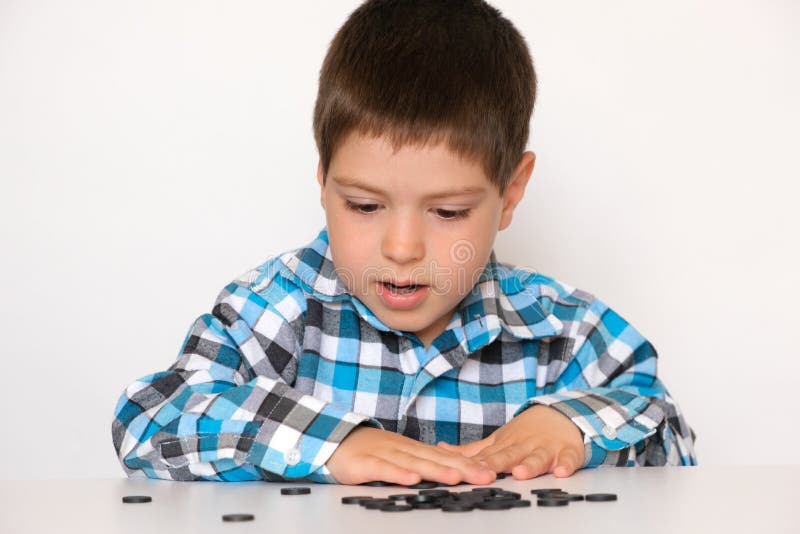 A 4-year-old Boy is Learning To Count, Teaching Black Numeracy Chips ...