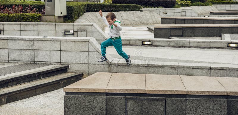 5 Year-old Boy Running Around the City Stock Image - Image of green ...