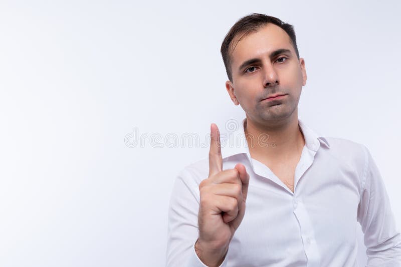 A 40-year-old Brunette Man Dressed in a White Shirt is Thinking about ...