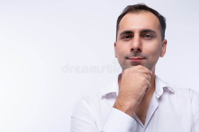 A 40-year-old Brunette Man Dressed in a White Shirt is Thinking about ...